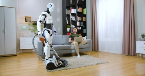 Robot Humanoid Cleaning Room Vacuum Cleaner Stock Footage Video (100% ...