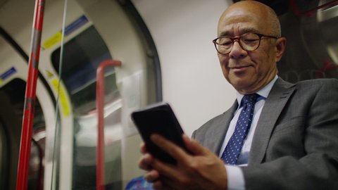 Senior Chinese Male Using His Phone Stock Footage Video (100% Royalty ...