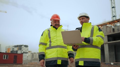 Foreman Civil Engineers Discussing Building Plan Stock Footage Video ...