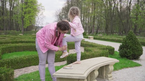 Nanny Puts Shoes On Little Girl Stock Footage Video (100% Royalty-free ...