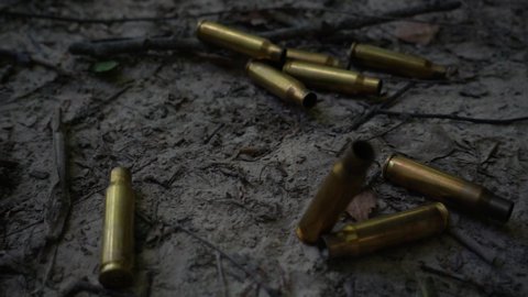 Bullet Casings Fall Ground Shooting Forest Stock Footage Video (100% ...