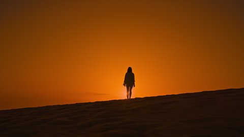 Young Girl Walking Into Sunset Desert Stock Footage Video (100% Royalty ...