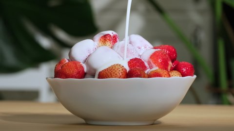 Pouring Yogurt On Strawberries Pitcher Slow Stock Footage Video (100% ...