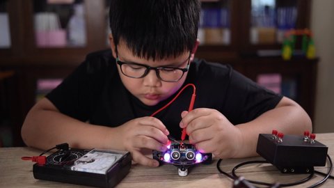 Asian Boy Working On Technology Experiment Stock Footage Video (100% Royalty-free) 1093003291 ...