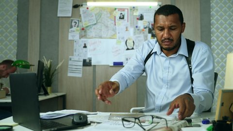 Handsome Detective Working On Evidences Case Stock Footage Video (100% ...