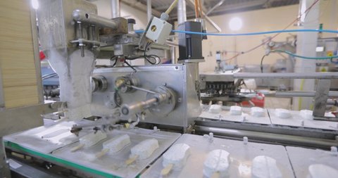 Ice Cream Dosing Machine On Conveyor Stock Footage Video (100% Royalty ...