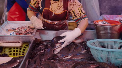 Woman Slaughtering Alive Fish Flea Market Stock Footage Video (100% ...