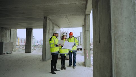 Engineers Building Inspectors Examining Building Plan Stock Footage ...