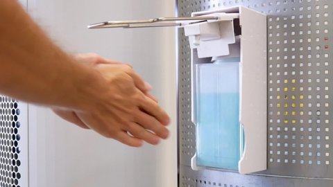 Closeup Mounted Hand Sanitizer Man Sanitizing Stock Footage Video (100% ...
