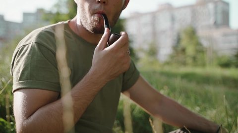 Man Lighting Pipe Puffs Smoke V3 Stock Footage Video (100% Royalty-free ...