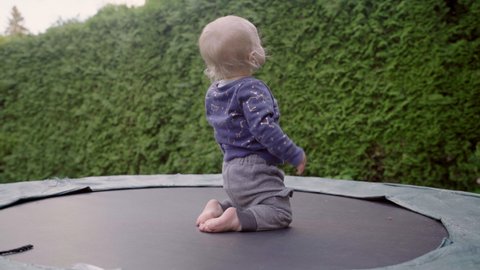 Cute Baby Hopping On Trampoline Backyard Stock Footage Video (100% ...