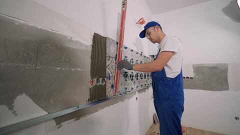 Installing Ceramic Wall Tiles Measuring Cutting Stock Footage Video ...