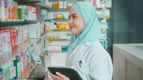 Muslim Female Pharmacist Working Modern Pharmacy Stock Footage Video ...