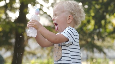 Happy Kid Drinking Water Baby Bottle Stock Footage Video (100% Royalty ...