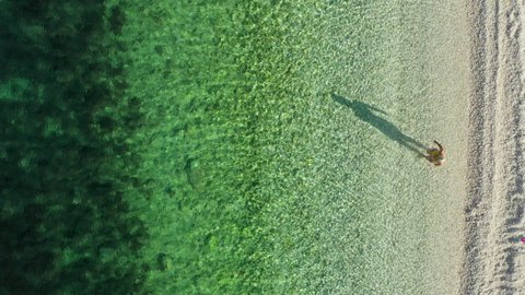 Aerial View Woman Diving Into Ocean Stock Footage Video (100% Royalty ...