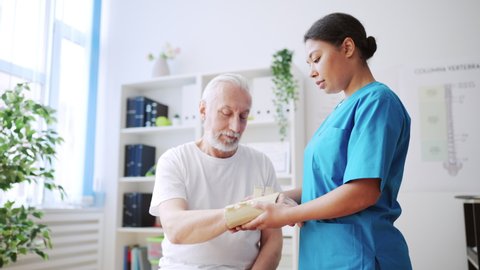 Female Doctor Removing Cast Patients Arm Stock Footage Video (100% ...