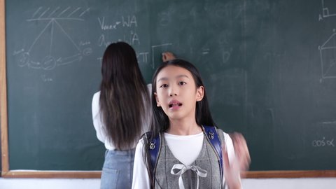 Smiling Asian Girl Student Writing Math Stock Footage Video (100% ...