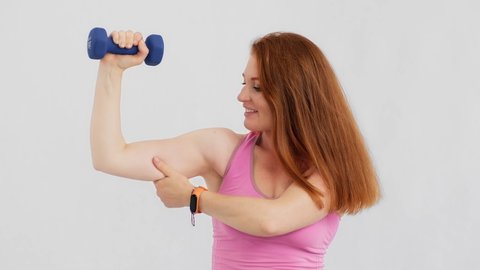 Redhead Woman Touching Biceps Dumbbell Hand Stock Footage Video (100% ...