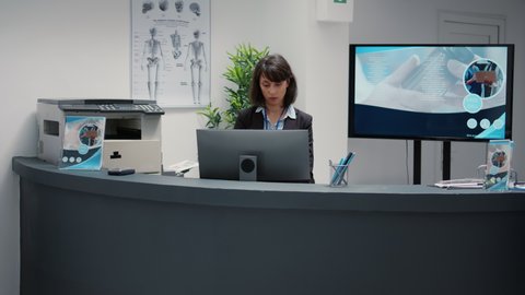 Portrait Hospital Reception Desk Employee Working Stock Footage Video ...