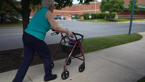 Elderly Senior Woman Pushing Walker Rolling Stock Footage Video (100% ...