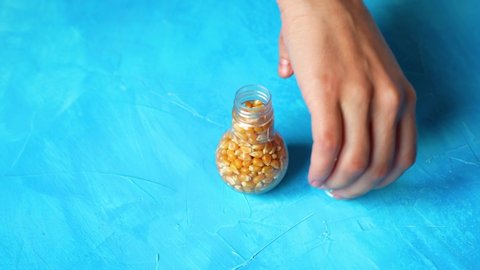 Hands Put Popcorn Kernels Into Light Stock Footage Video (100% Royalty ...