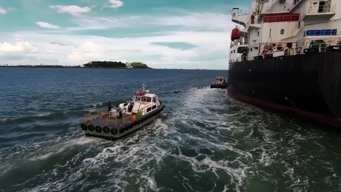 4k Container Ship Sailing Escorted By Stock Footage Video (100% Royalty ...