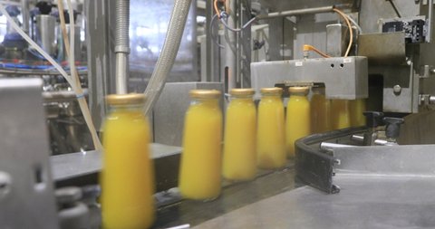 Robotic Automation Line Bottling Juice Into Stock Footage Video (100% ...