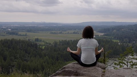 Adventurous Woman Meditation Overlooking Canadian Nature Stock Footage ...