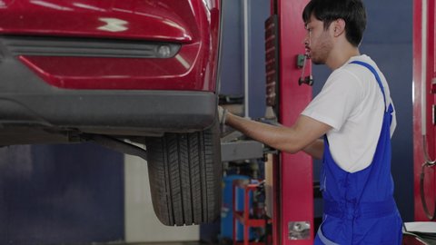 Auto Mechanic Putting Wheels On Car Stock Footage Video (100% Royalty ...