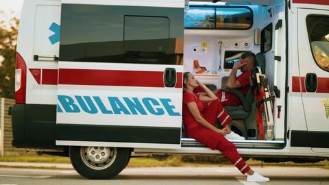 Tired Emergency Medical Service Team Sitting Stock Footage Video (100% ...