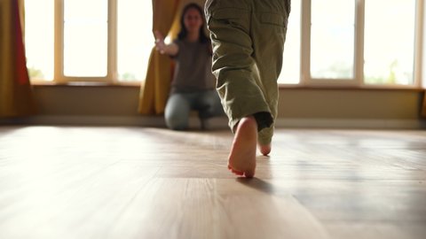 Baby Takes First Step On Floor Stock Footage Video (100% Royalty-free ...