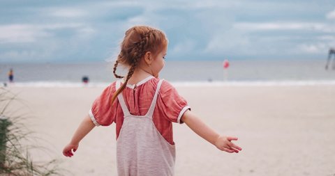 Following Redhead Baby Girl That Goes Stock Footage Video (100% Royalty ...
