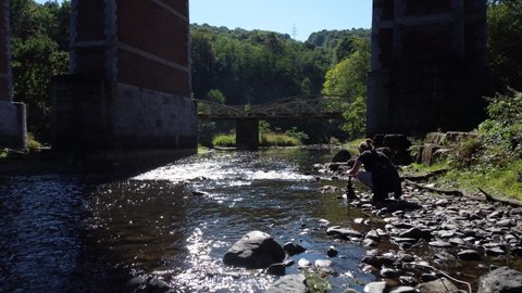 Woman Stacks Pebble Stones Ambleve River Stock Footage Video (100% ...