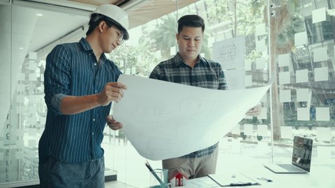 Engineers Helping Design Work On Blueprints Stock Footage Video (100% ...