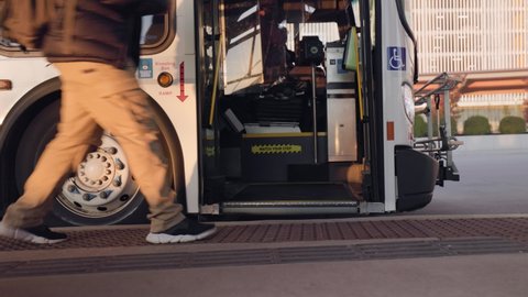 Man Enters Waiting Bus During Daytime Stock Footage Video (100% Royalty ...