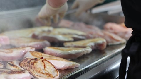 Chef Flipping Chicken Breasts On Hot Stock Footage Video (100% Royalty ...