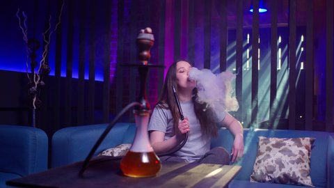 Young Pretty Woman Sitting Smoking Hookah Stock Footage Video (100% ...