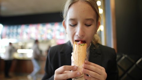 Young Teenage Girl Eating Tasty Sandwich Stock Footage Video (100% ...