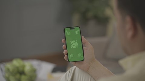 Man Watching Iphone 14 Pro Green Stock Footage Video (100% Royalty-free ...