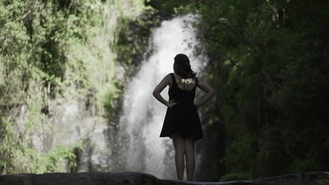 Caucasian Woman Observes Waterfall Over Rocks Stock Footage Video (100% ...