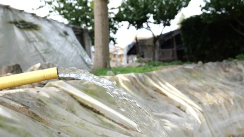 Running Water Out Rubber Garden Hose Stock Footage Video (100% Royalty ...