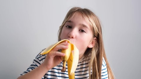 Adorable Little Schoolage Girl Eating Ripe Stock Footage Video (100% ...