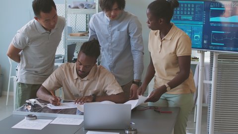 Four Diverse Electrical Engineers Discussing Technology Stock Footage ...