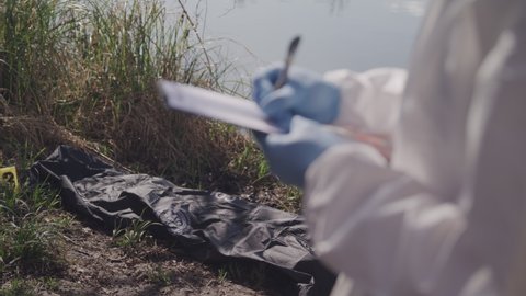 Investigator Taking Notes Crime Scene Stock Footage Video (100% Royalty ...