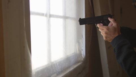 Guy Points Gun Through Window Stock Footage Video (100% Royalty-free ...