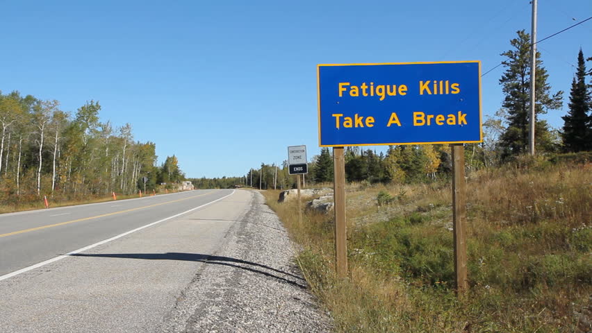 Fatigue Kills Sign with Traffic Stock Footage Video (100% Royalty-free ...