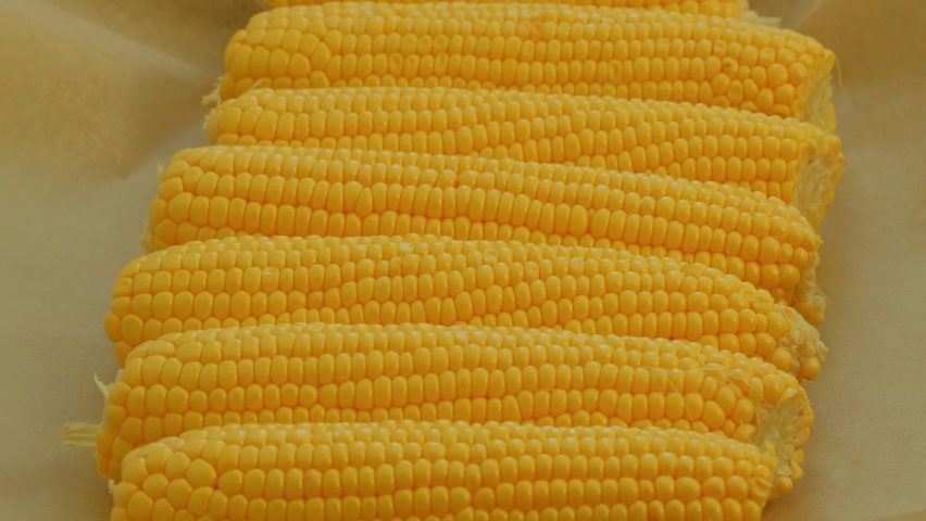 The corn cobs on a rotating table Food & Drink Videos | Creative Market