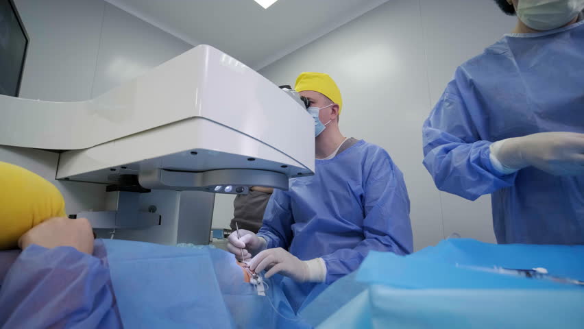Laser vision correction. Surgeon in the operating room during ...