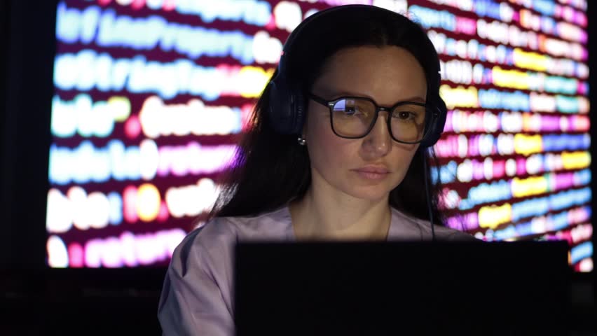 Close-up young Asia girl IT development programmer typing on keyboard coding programming fixing ...