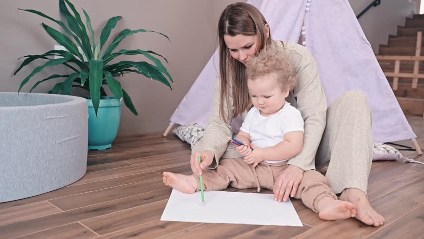 Hispanic woman her little 4s daughter holds pencils accomplish drawing ...